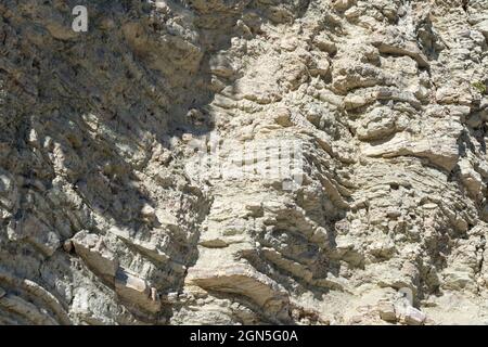White layered cliff sharp rocks texture, geology close-up, coast of ...