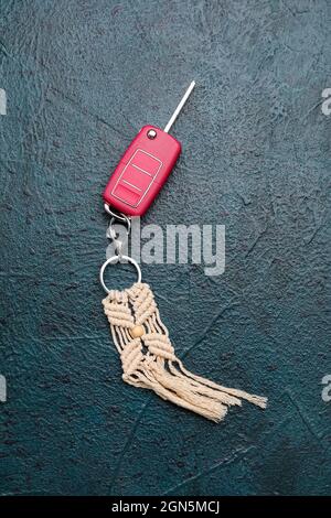 Car key with handmade cotton keychain on white background Stock Photo ...