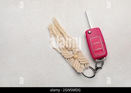 Car key with handmade cotton keychain on white background Stock Photo ...