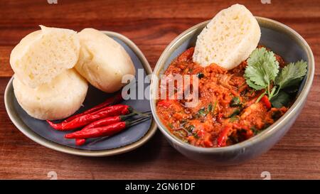 Steamed rice cakes and red chili peppers on the plate Stock Photo - Alamy
