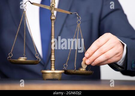 Concept of earning balance with businessman that weighs the money Stock ...