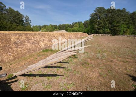 Trench, ditch with sharpened inclined log fraise defense. At the ...
