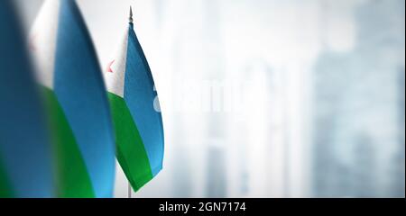 Small flags of the Djibouti on an abstract blurry background Stock ...