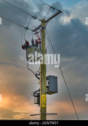 A metal electricity pylon (UK) showing danger signs. Also known as a ...