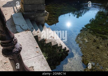 Steps lead down to the River Beze by the stone bridge, Cote d'Or ...