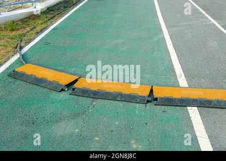 Black and yellow heavy plastic covers for people and vehicle to cross ...