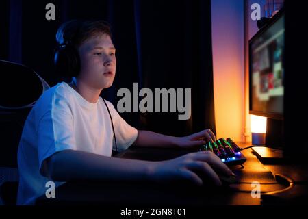 Boy is playing a computer game at home Stock Photo - Alamy