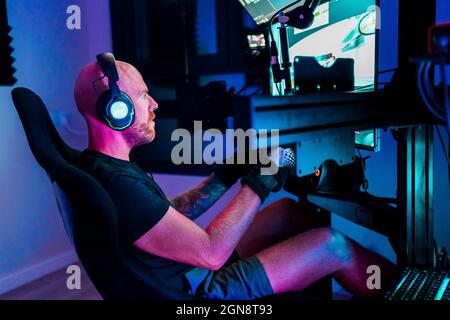Bald european man playing online game on mobile phone isolated over ...