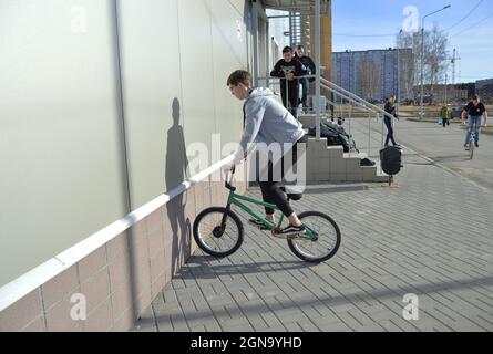 Kovrov, Russia. 9 April 2017. Teens who ride on BMX bikes near the shopping center Rus Stock ...