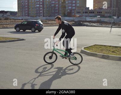 Kovrov, Russia. 9 April 2017. Teen on BMX bike near the shopping center Rus Stock Photo - Alamy