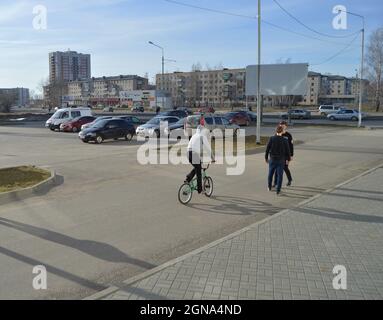 Kovrov, Russia. 9 April 2017. Teens who ride on BMX bikes resting on steps shopping center Rus ...