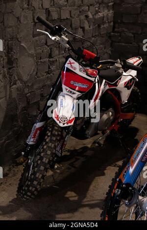 VINNYTSIA, UKRAINE - Jun 17, 2021: A display of the new colorful dirt bikes in the store Stock ...