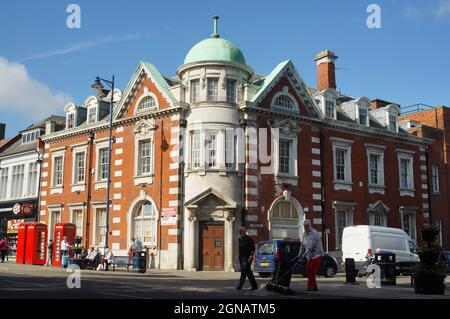 Post office, red telephone boxes, cones and traffic light, waterfront ...