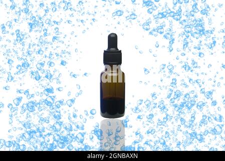 Background with water drops bottle with essential oil and flowers ...