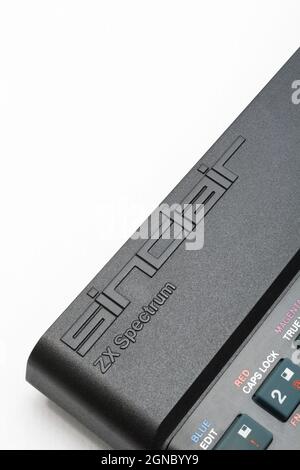 Close shot of raised Sinclair ZX Spectrum logo on black casing. Vintage ...