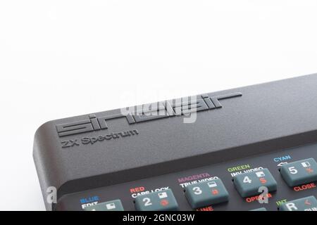 Close shot of raised Sinclair ZX Spectrum logo on black casing. Vintage ...