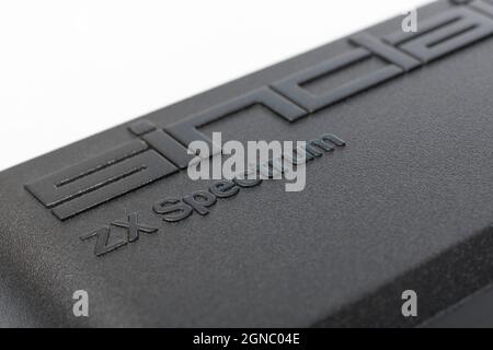 Close shot of raised Sinclair ZX Spectrum logo on black casing. Vintage ...