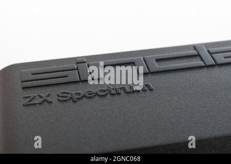 Close shot of raised Sinclair ZX Spectrum logo on black casing. Vintage ...