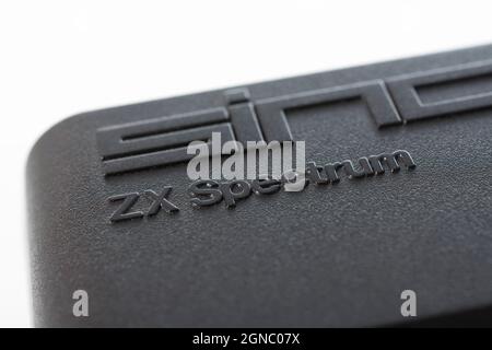 Close shot of raised Sinclair ZX Spectrum logo on black casing. Vintage ...