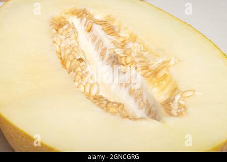 yellow ripe melon cut in half close-up, seasonal berry Stock Photo - Alamy
