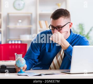 Young employee preparing for vacation trip Stock Photo - Alamy