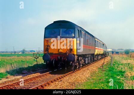 A class 47 locomotive number 47701 departs London Waterloo with a ...