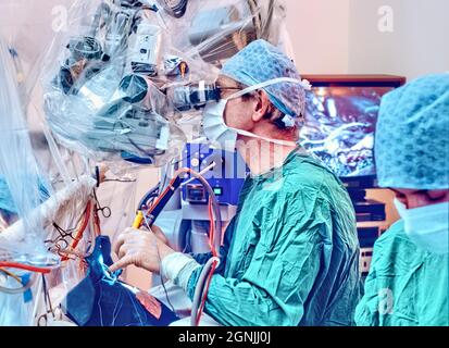 Treatment of a brain aneurysm. Surgical operation on the brain. A team ...