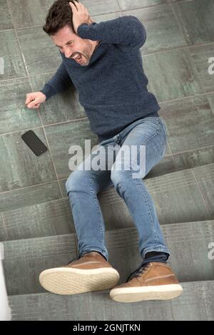 Unconscious Handyman Fallen From Ladder With Equipment Lying On Floor ...