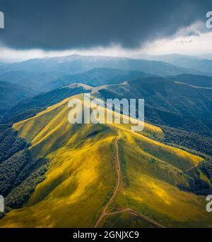 aerial view of carpathian mountains overcast weather suv car on trail ...