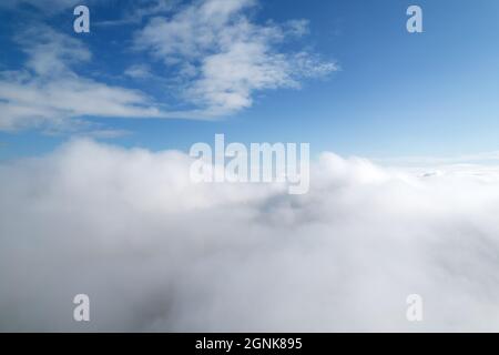 A beautiful shot of fluffy clouds in a bright blue sky Stock Photo - Alamy