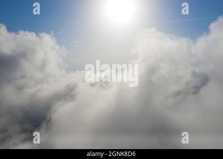 A beautiful shot of fluffy clouds in a bright blue sky Stock Photo - Alamy