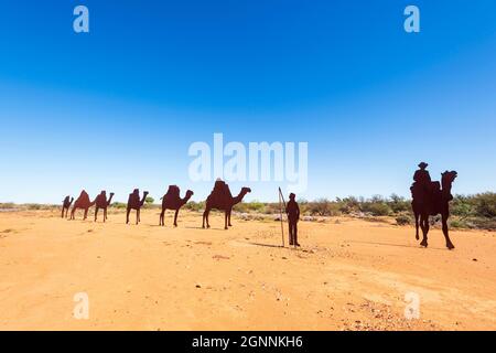 Metal statues of a camel train to commemorate Alfred Canning surveying ...