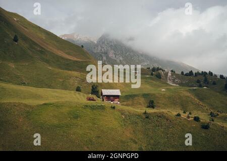 Alpine huts on Hill Stock Photo - Alamy