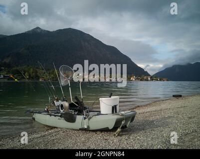 Fancy fishing boat on the beach with fishing rods, brailer and bucket ...