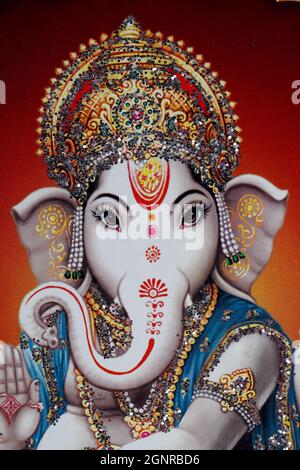 Hindu elephant-headed god Ganesha, Ganesh or Ganpati mounted on a rat ...