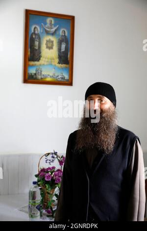 Rudi orthodox monastery, Moldova. Abbot serving a guest Stock Photo - Alamy