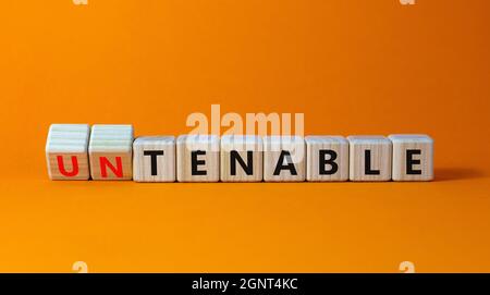 Tenable or untenable symbol. Turned wooden cubes and changed the word ...
