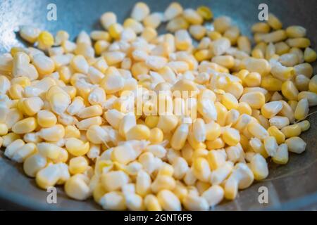 Fresh Sweet Corn Grains separating from the corncob Stock Photo - Alamy