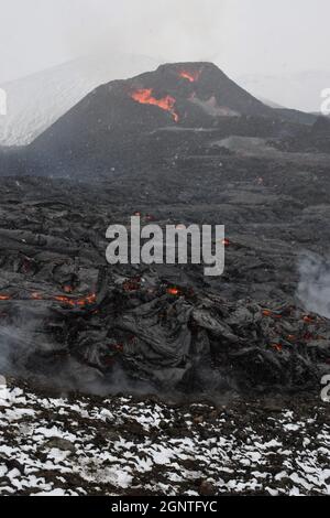 Two vents at the Fagradalsfjall eruption in Iceland. Black lava field ...