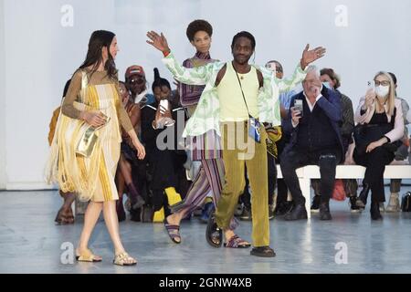 Designer Kenneth Ize makes an appearance on the runway during the ...