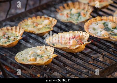 Detail of cooking on the grill of scallops with smoke Stock Photo - Alamy
