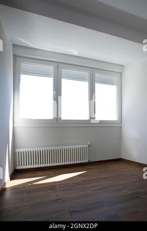 Modern office with window and radiator. Interior design Stock Photo - Alamy