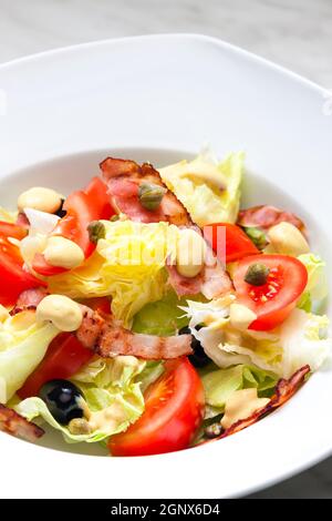 vegetable salad with bacon and capers Stock Photo - Alamy
