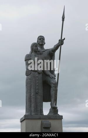 Statue of Helgi the Lean (Helgi Magri Eyvindarson), and his wife ...