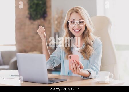 Photo of shiny excited lady wear yellow t-shirt hair fluttering air ...