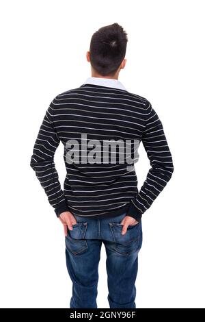 Handsome teen boy with his back turned to camera, pointing to something ...