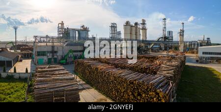 Aerial view of wood processing factory with stacks of lumber at plant ...