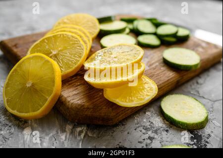 Cutted lemon and cucumber on grunge background Stock Photo - Alamy