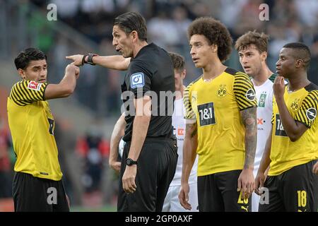 From left: Mahmoud Dahoud, referee Benjamin Brand, Nathaniel Brown ...