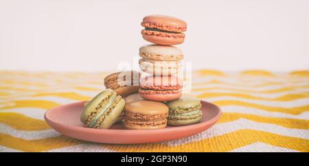 Macarons tower dessert at home. Cute retro vintage pink plate on ...